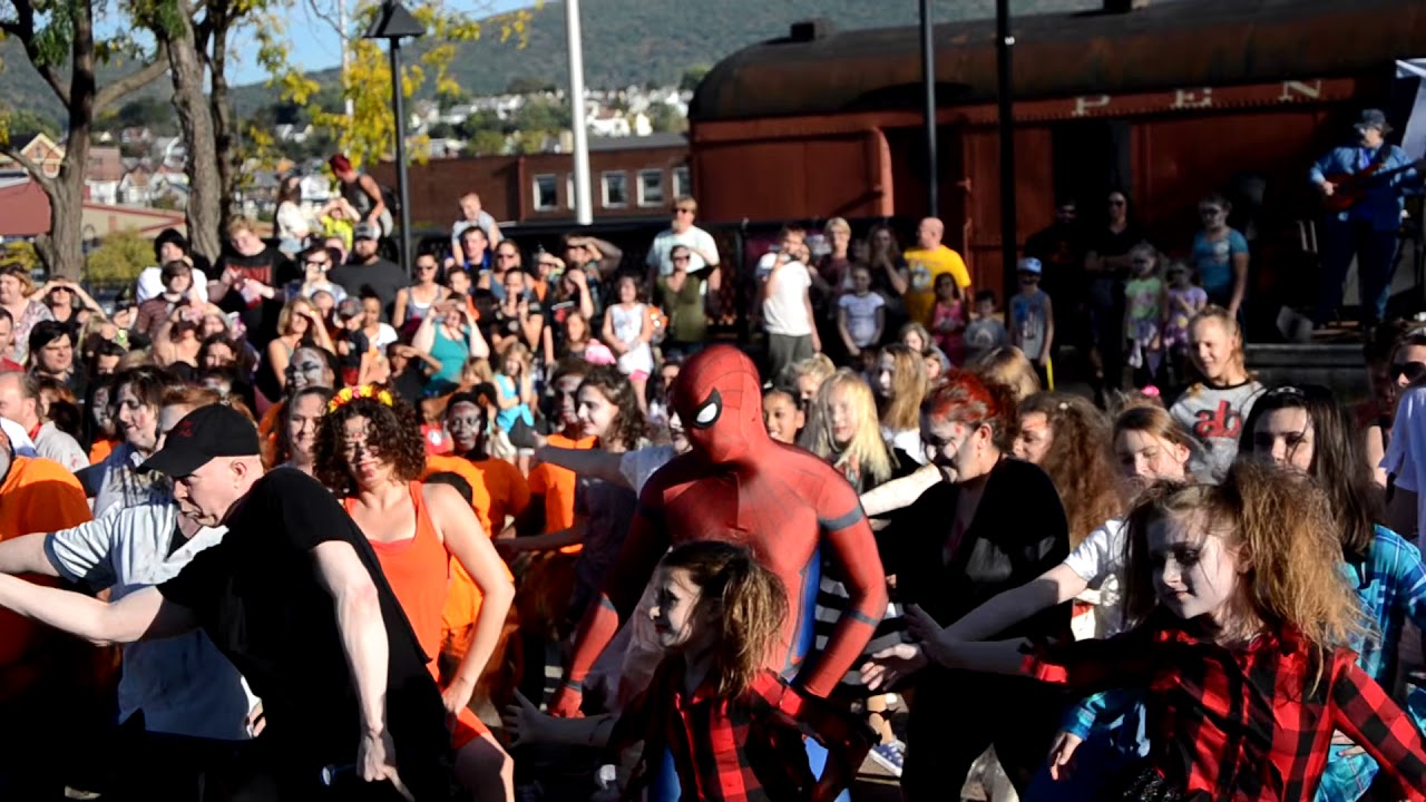 Zombie flash mob, and Spiderman, dance to Thriller at Zombietown USA ...