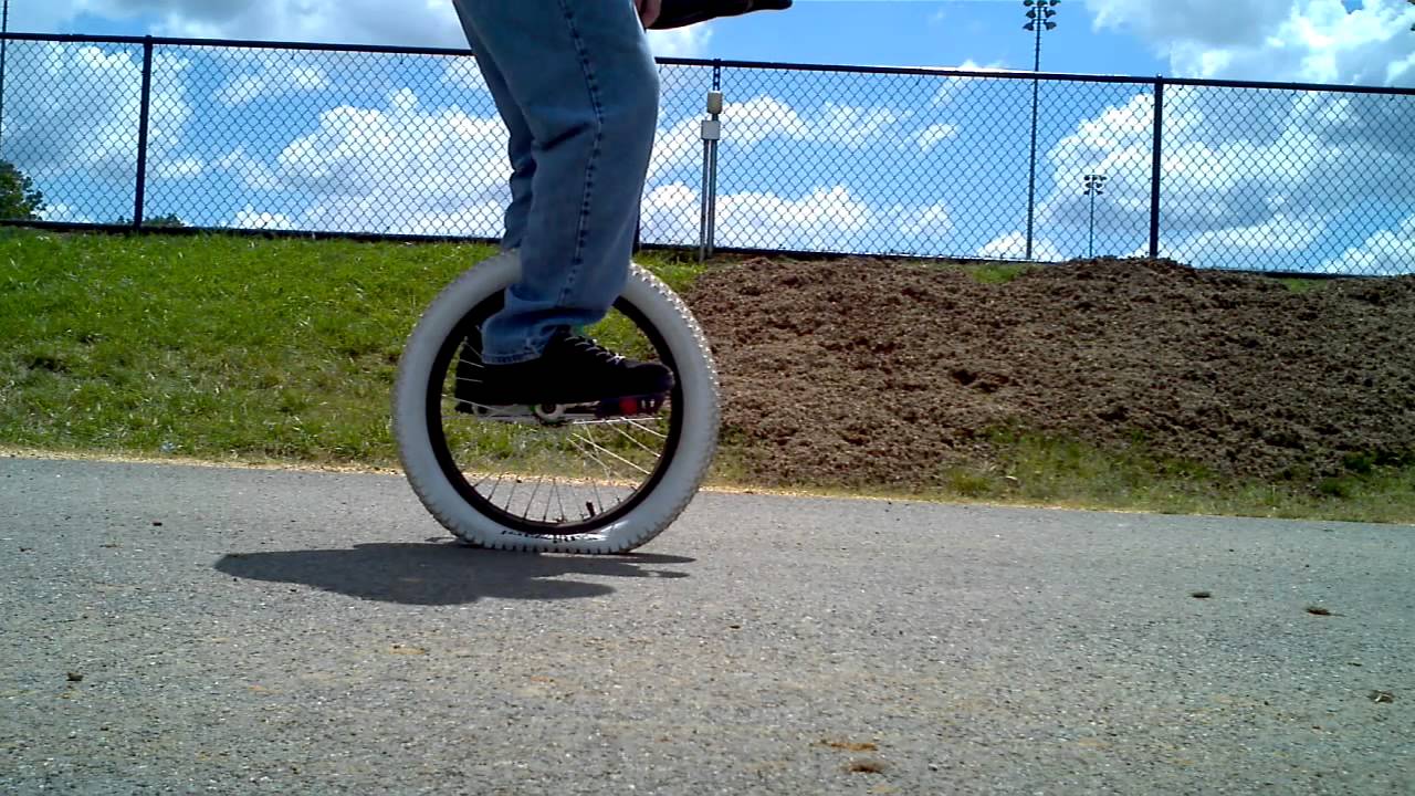 Learning how to leg wrap and reverse leg wrap on a Unicycle - YouTube