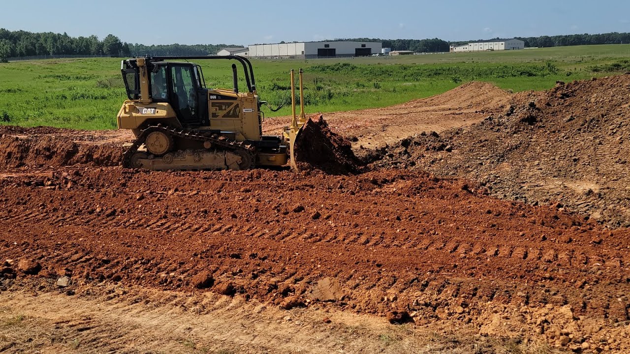 Pushing dirt and building a road base. - YouTube