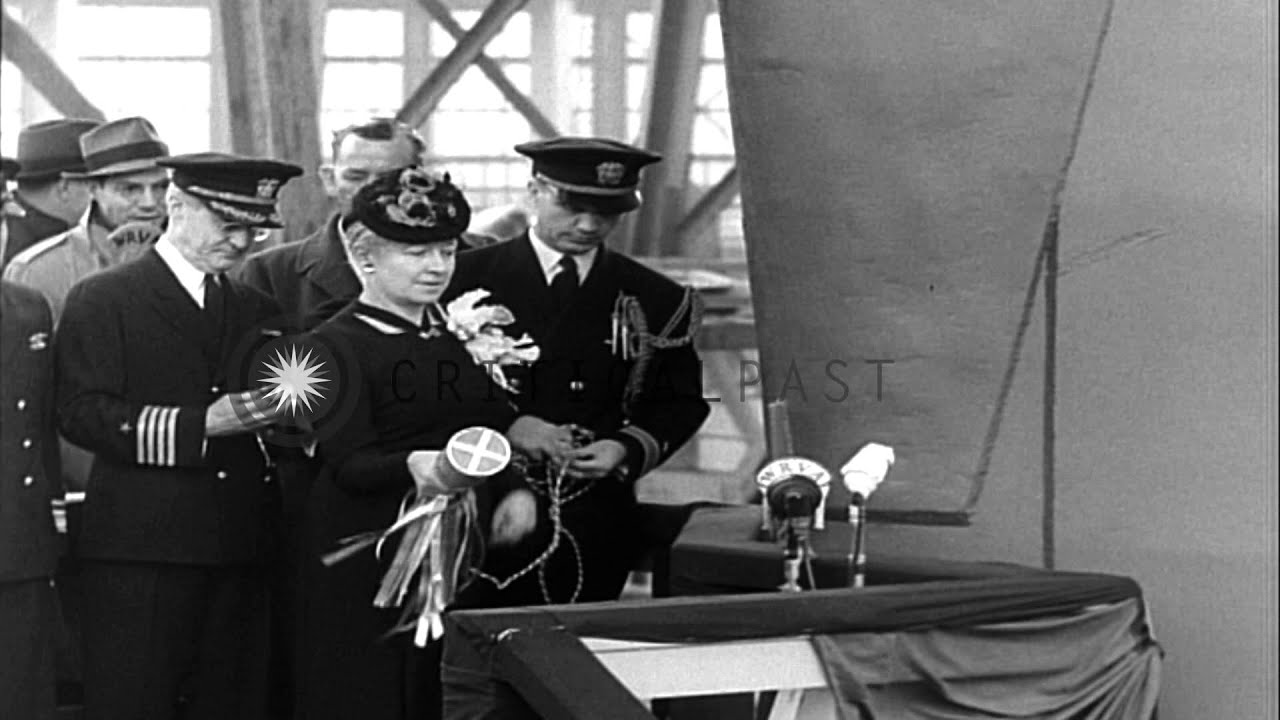 Mrs. Doolittle poses with bottle, christens USS Shangri-La as it is ...