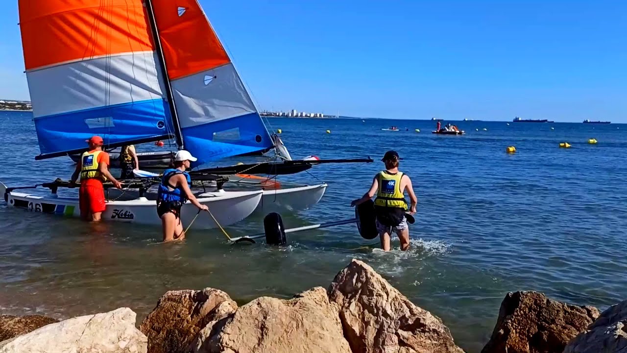 Beach in Fos-sur-Mer, girls on a catamaran - YouTube