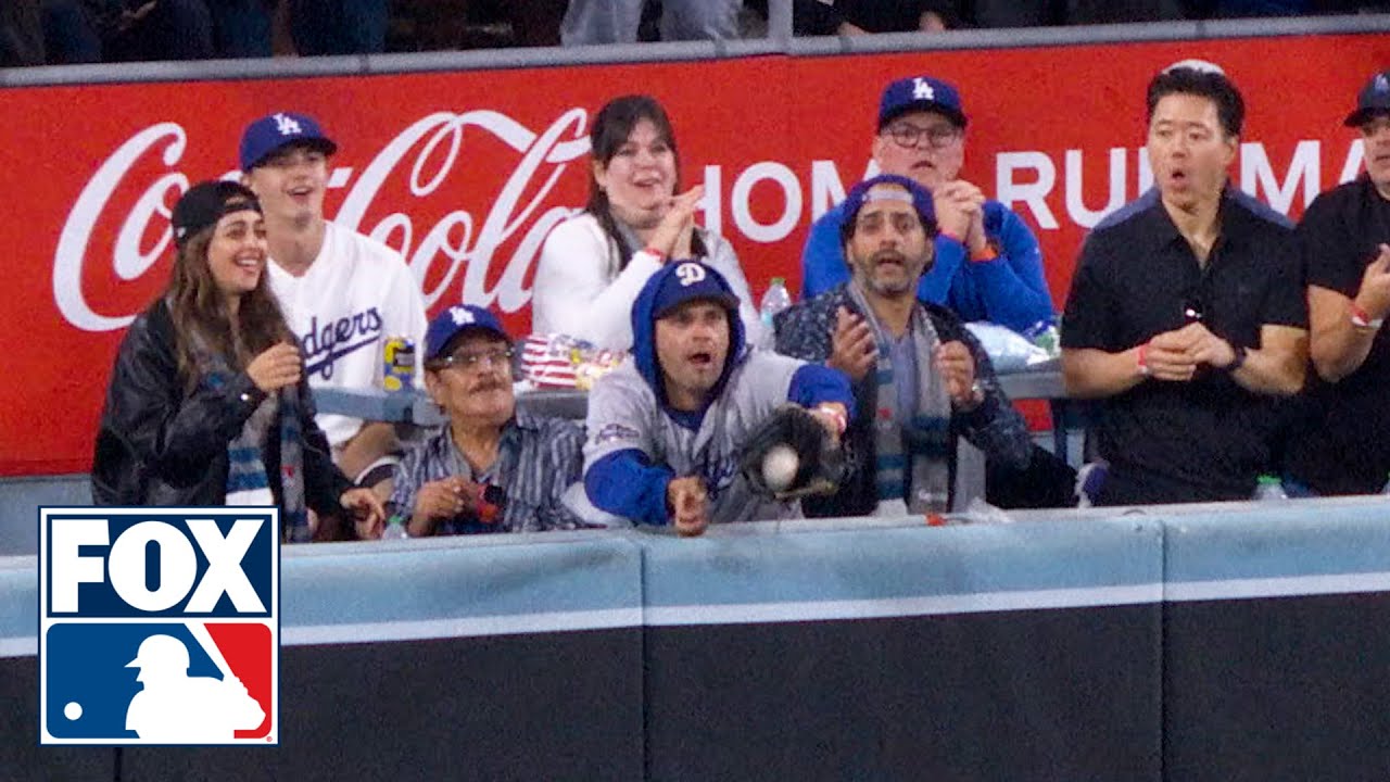 Fan interferes at World Series and reaches for ball at the wall in ...