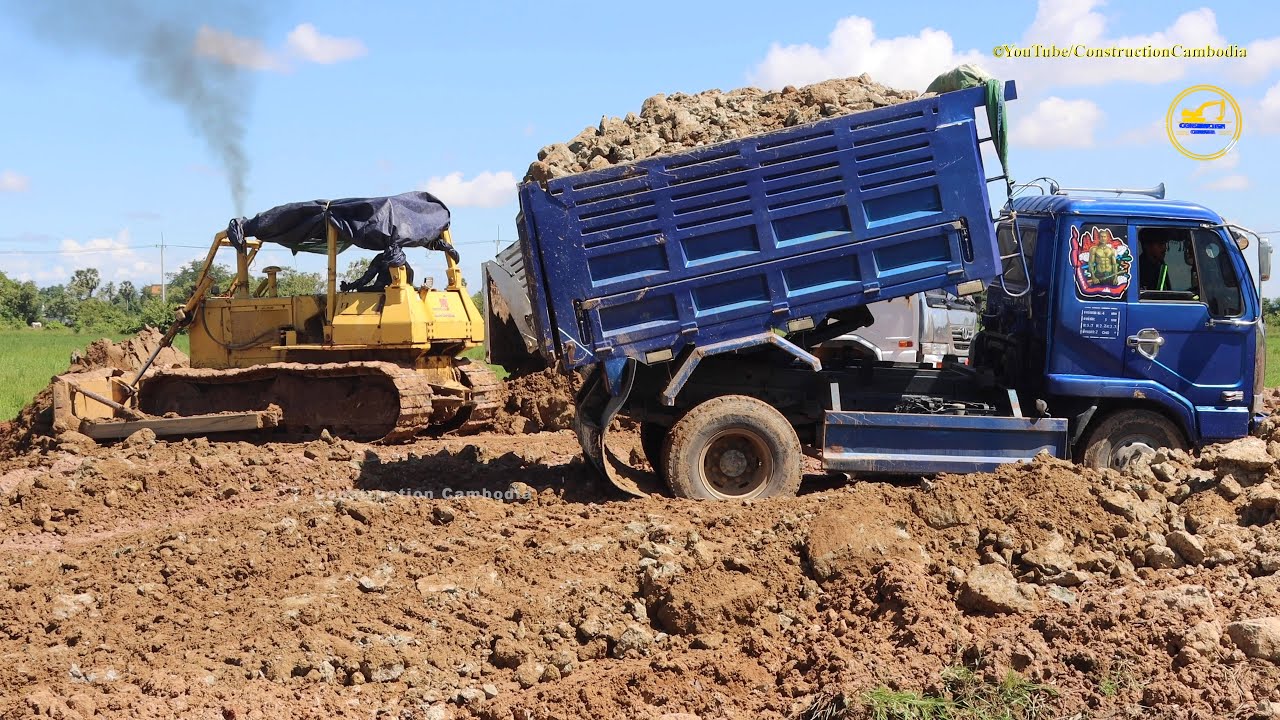 Dozers And Dump Trucks Working | Komatsu Dozer Push Soilfill In Rural ...