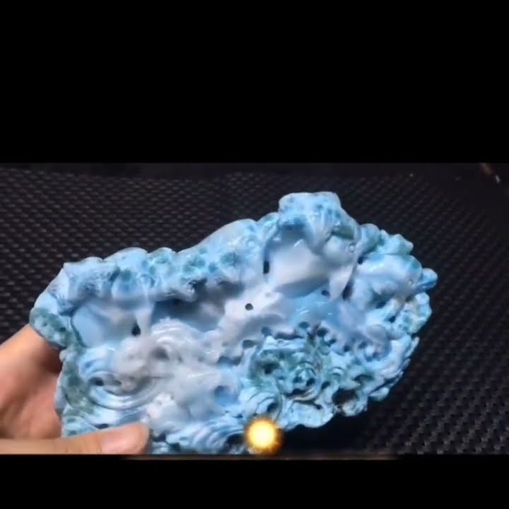 natural larimar dophins in the ocean carvings - YouTube