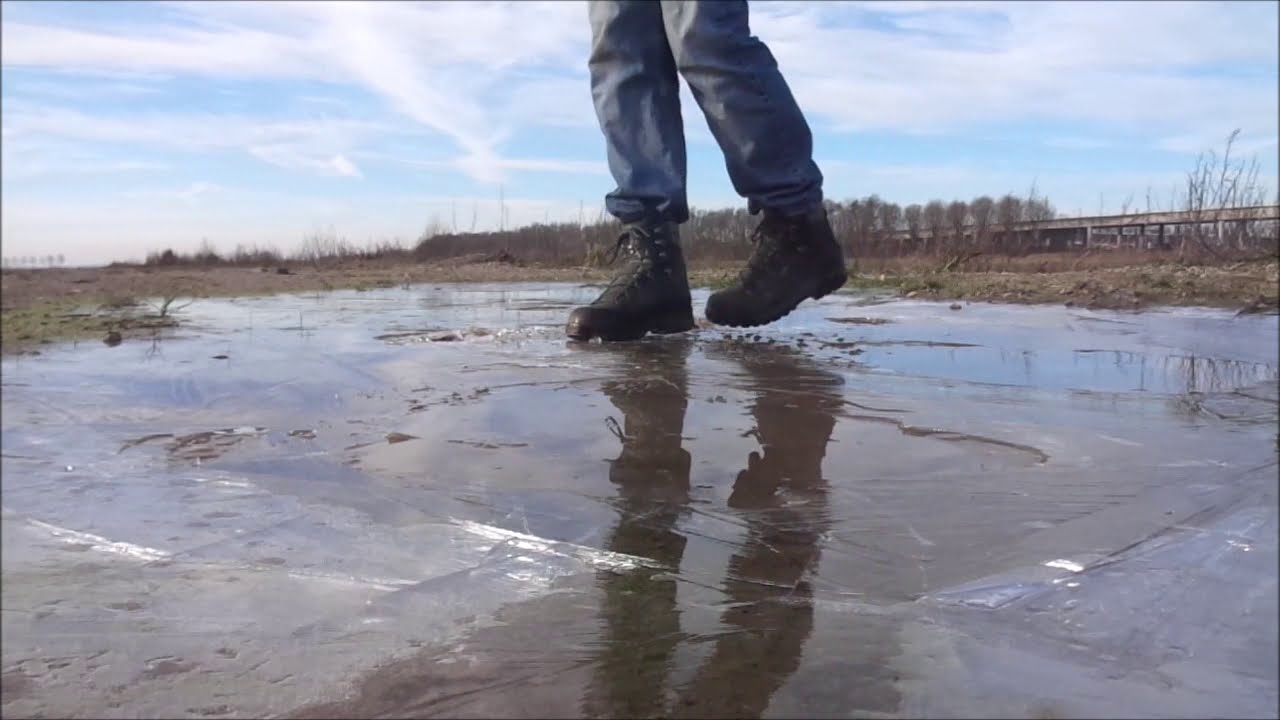 Lowa hiking boots walk on ice stomp, trample and destroy frozen puddle ...