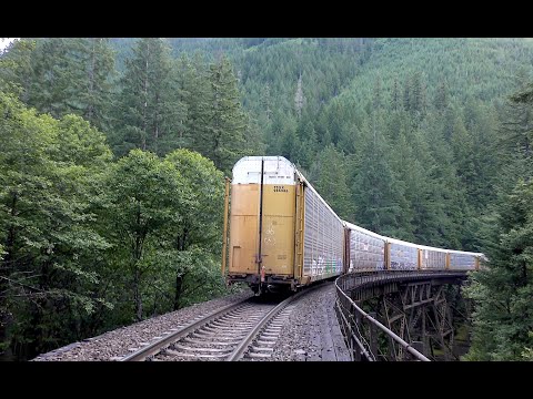 BNSF FRED (Flashing rear end device) winks as an auto train crosses Foss river bridge in Washington