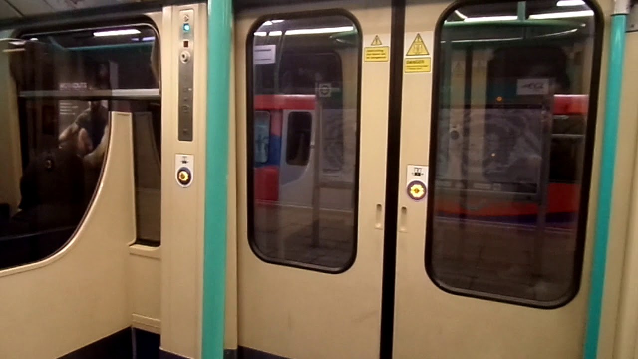 B90 Stock 26A DLR Doors Open and Close at Island Garden - YouTube