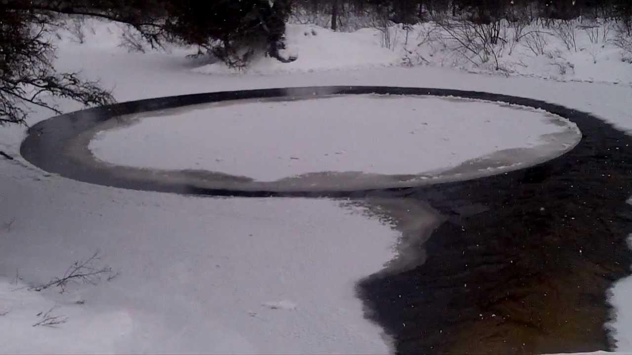Strange spinning ice circle in river - YouTube