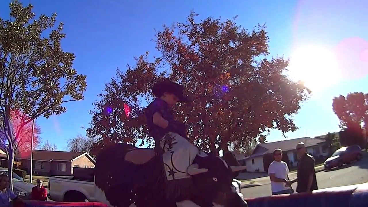 Kid riding mechanical bull - YouTube