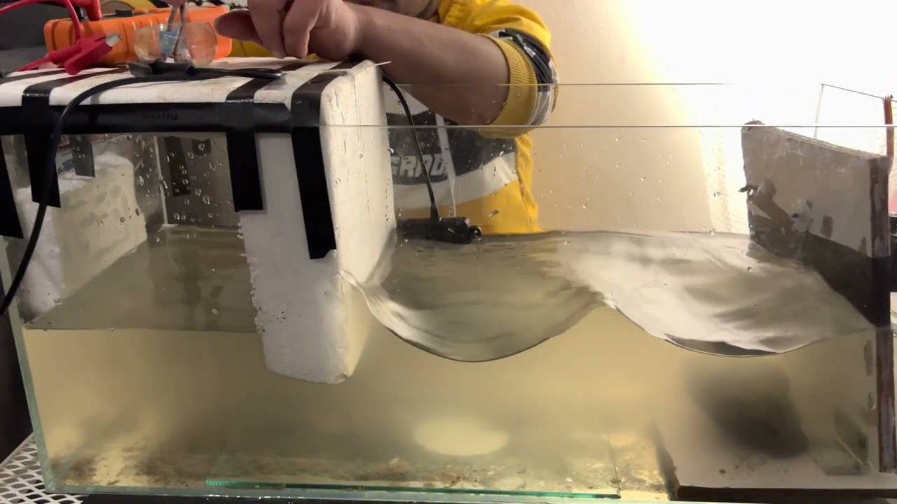 Cross section of wave tank with board making waves - YouTube