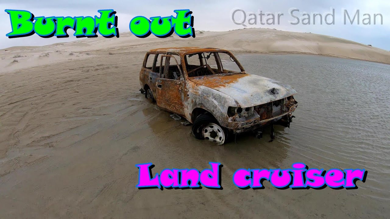 Burnt out Land Cruiser in the Qatar desert - YouTube