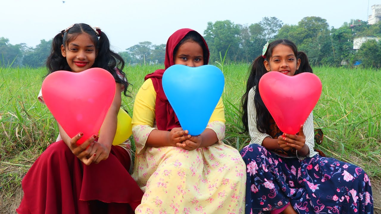 girl fun with balloon in outdoor field and learn color for kids by ...