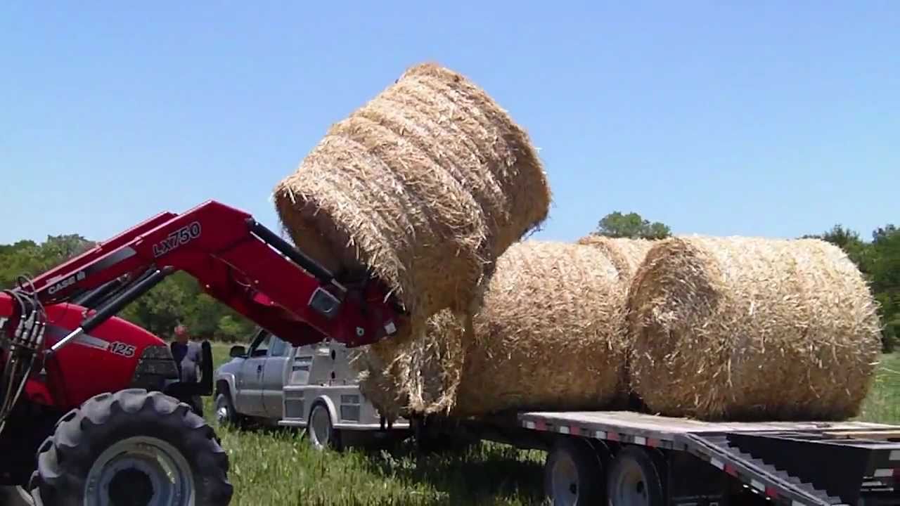 LB7 Duramax Hauls Round Hay Bales - YouTube