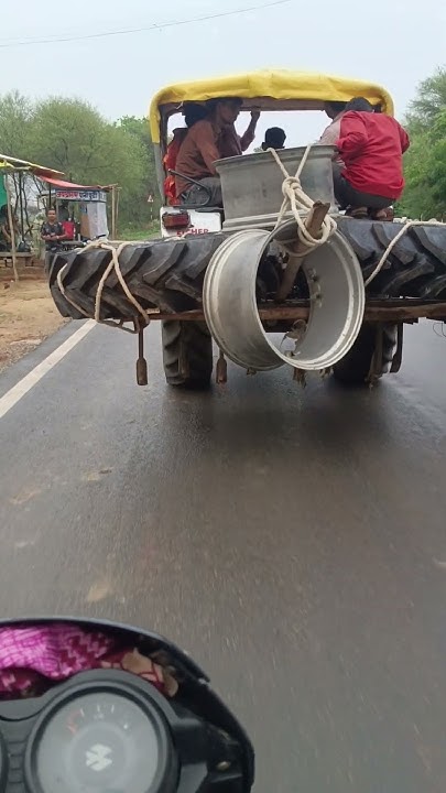 desi jugaad two huge tractor tyres and two rims on cultivator - YouTube