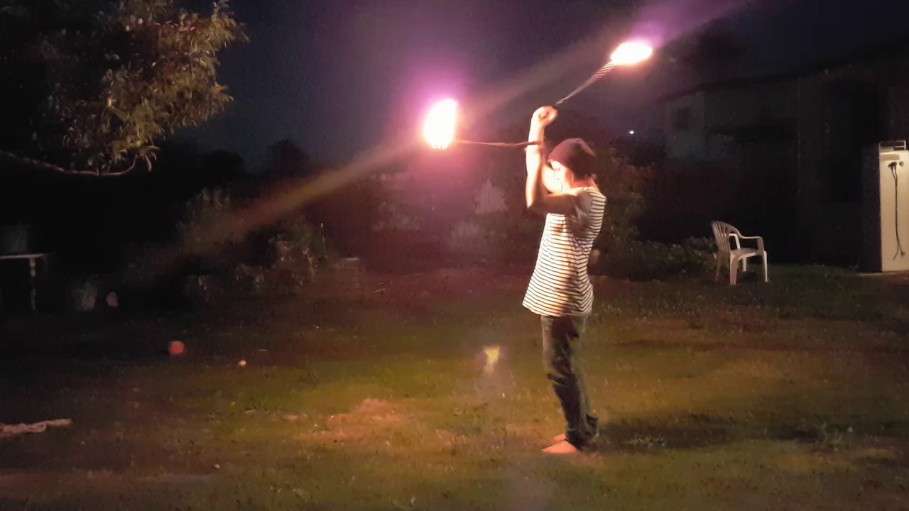 Fire twirling fire poi - YouTube