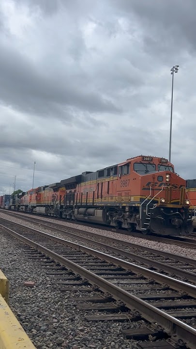 Eastbound BNSF port stack meets with a power move with BNSF 3987 leading and a NS unit trailing ...