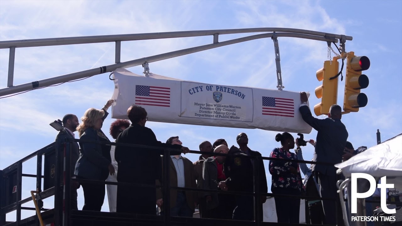 Paterson unveils street sign recognizing Eva's Village - YouTube