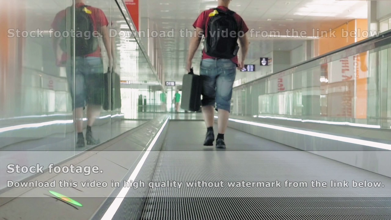 Person is walking on moving pathway in the airport - YouTube