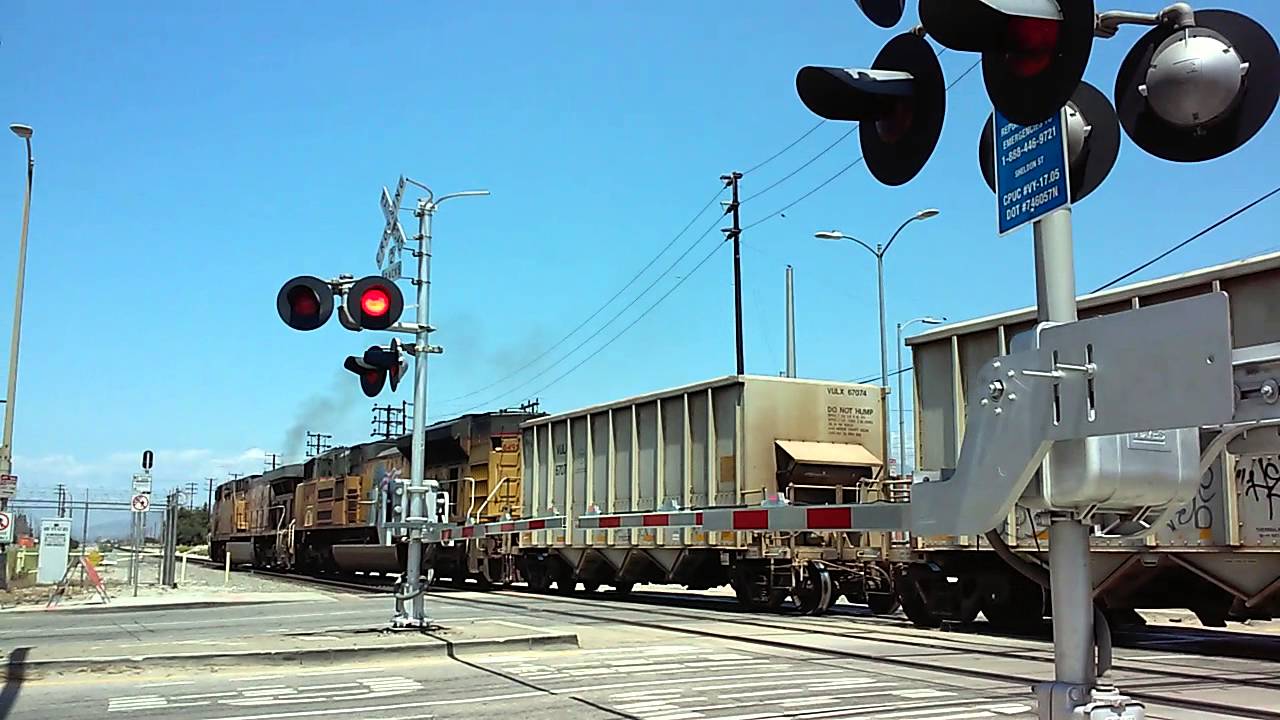 Metrolink 263 and Union Pacific Rock Train. - YouTube