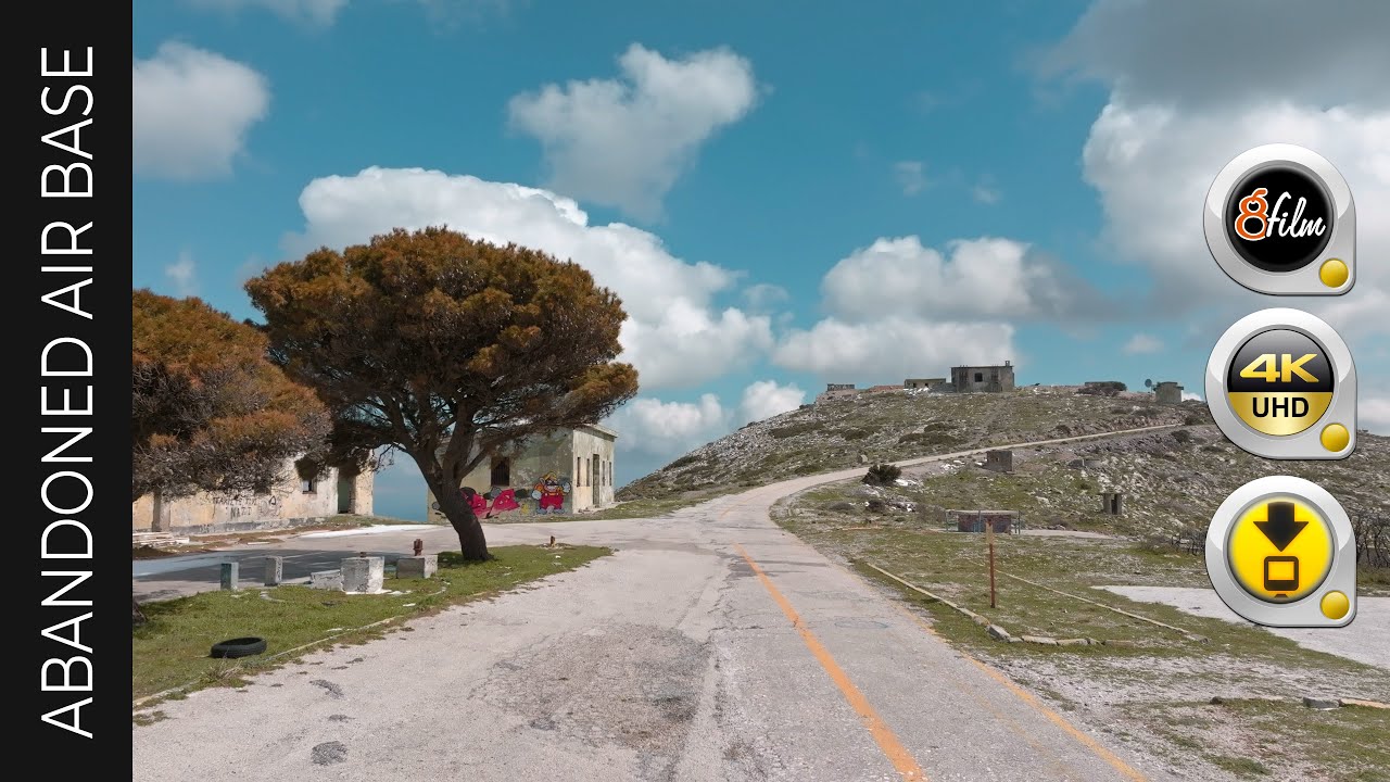 Abandoned Air Base, empty destroyed buildings on a mountain. Aerial ...