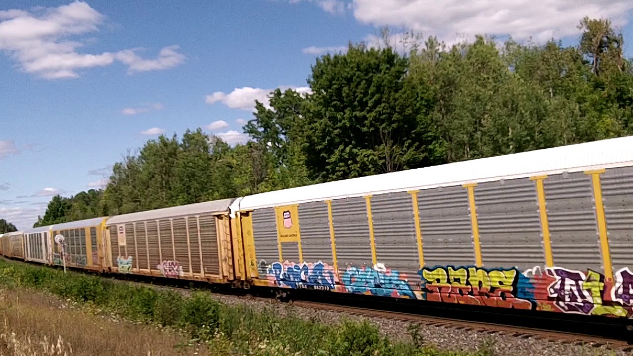 CN 273 w/ CN Engine 3831 Running Solo leads this long 446 axle, WB ...