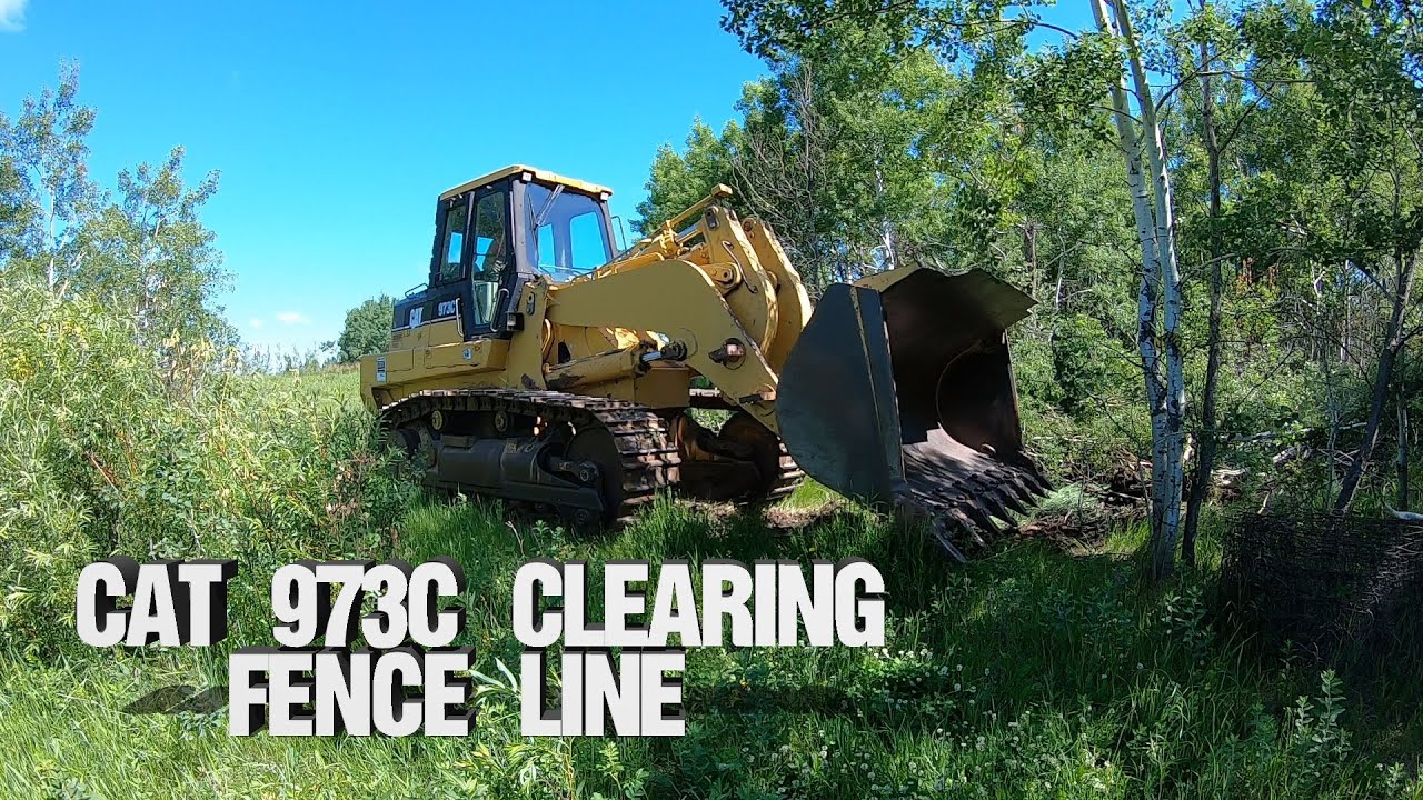 Fence Line Clearing Job CAT 973C Track Loader Part 1 - YouTube