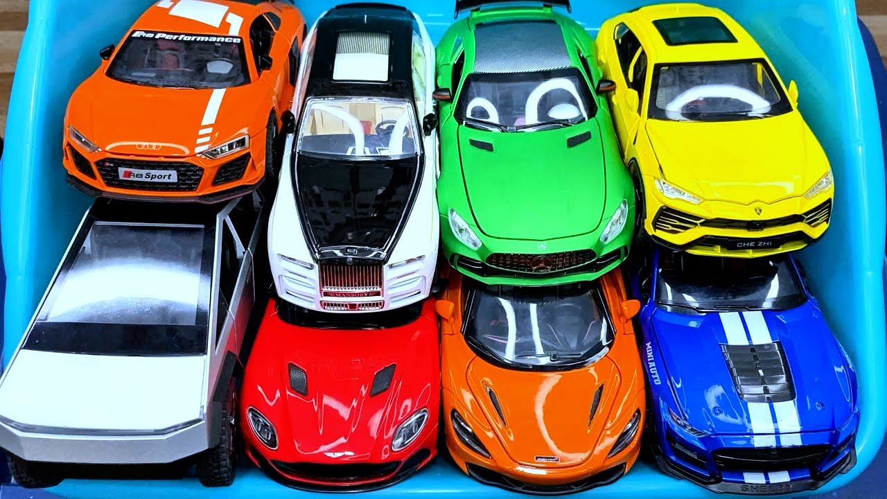 Box full of various miniature cars Jaguar, Peugeot, Renault, Hyundai ...