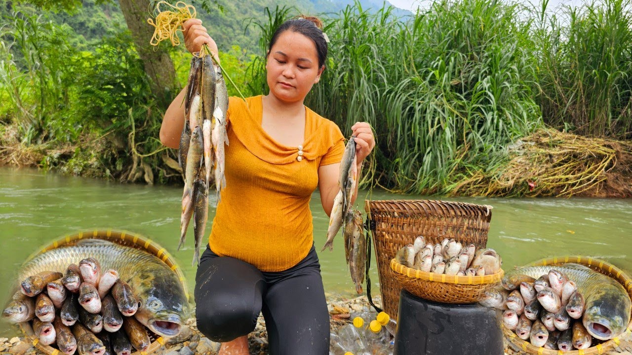 The single girl catches fish using a very simple but extremely ...