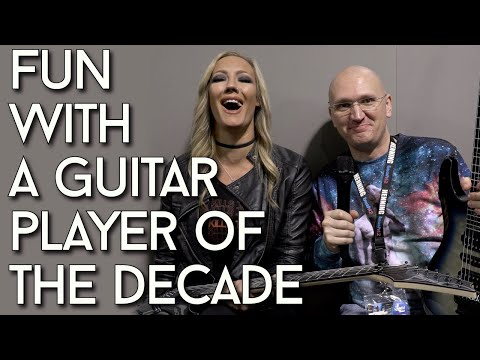 The lady can play and has great taste in axes! Nita Strauss