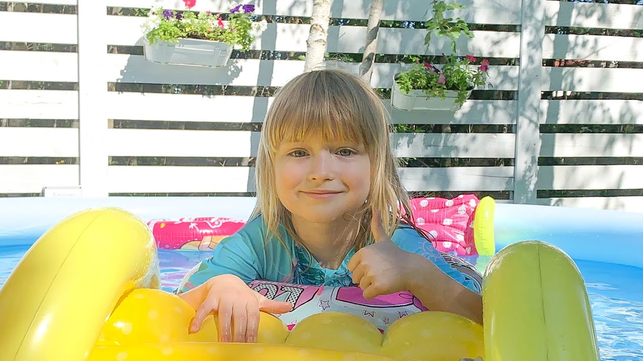 Diana swims in the pool and plays with water toys - YouTube