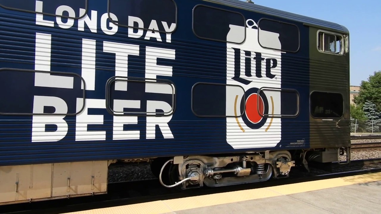 Metra inbound train in Naperville with a metra Miller lite beer wrap ...