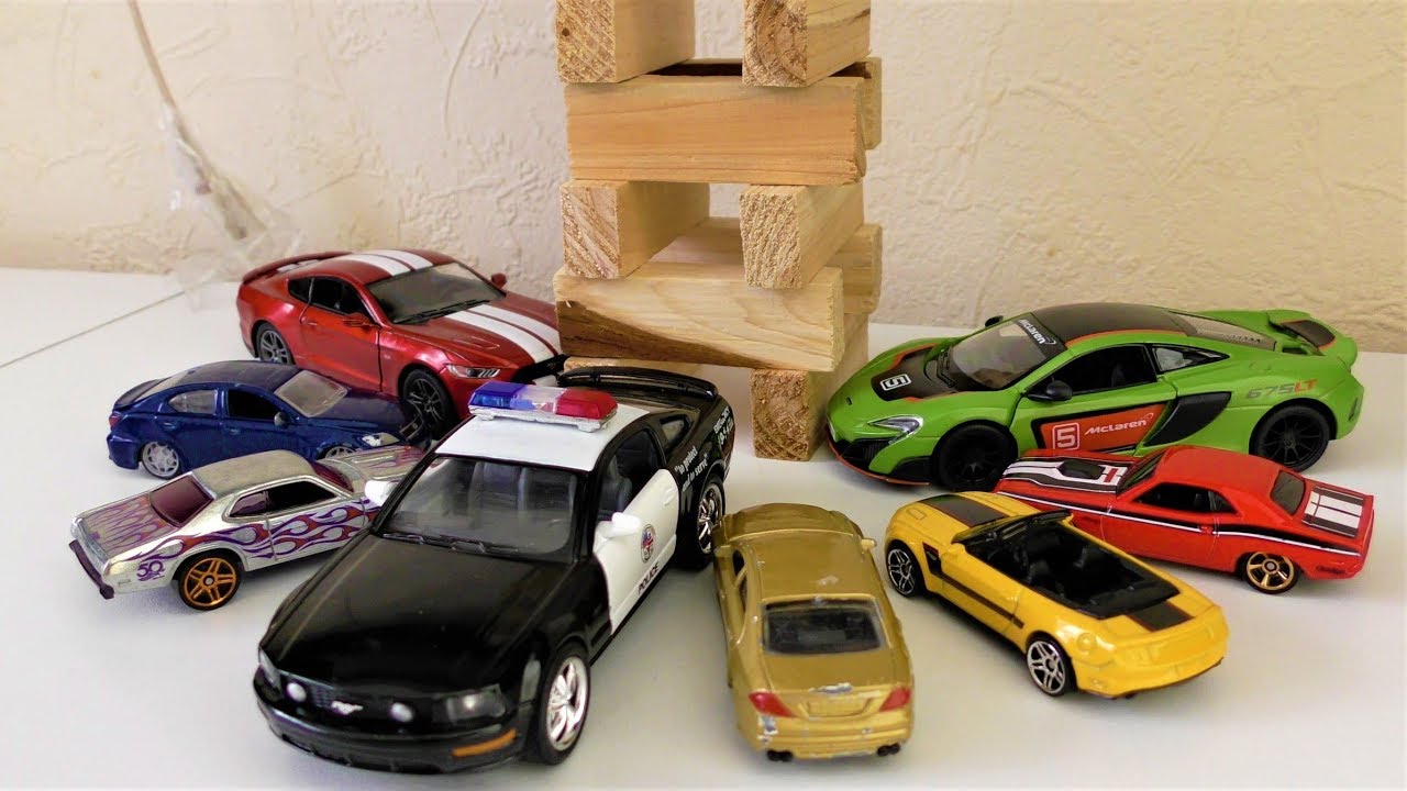 TOY CARS BUMP INTO JENGA TOWER - YouTube