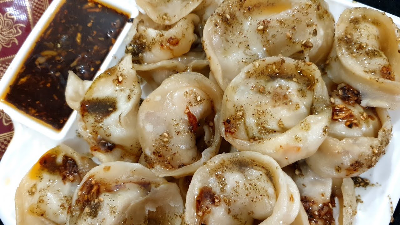 Steamed Chicken Momos/Dumpling(Dim Sum)with hot dipping sauce by get to ...