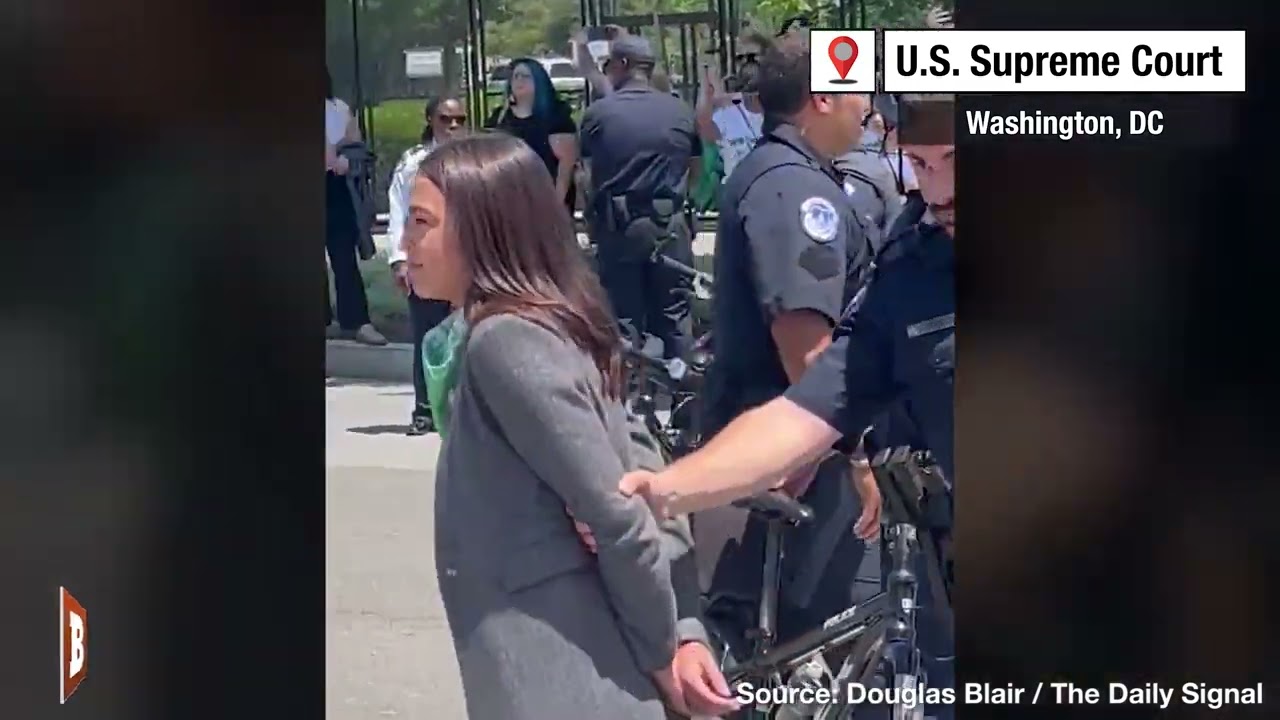 Conflicting Virtue Signals: AOC Pretends She's Handcuffed... Until She ...
