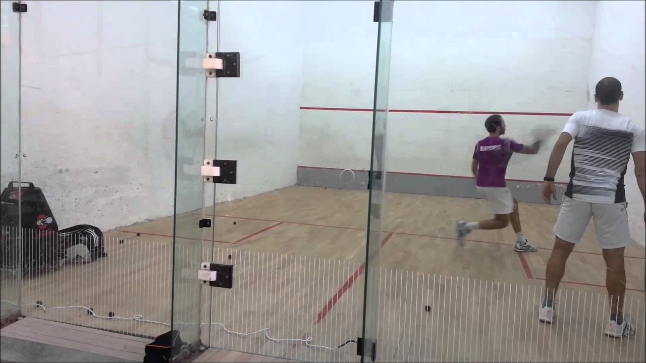 Marwan Elshorbagy training with coach Ashraf Yassin using the squash ...