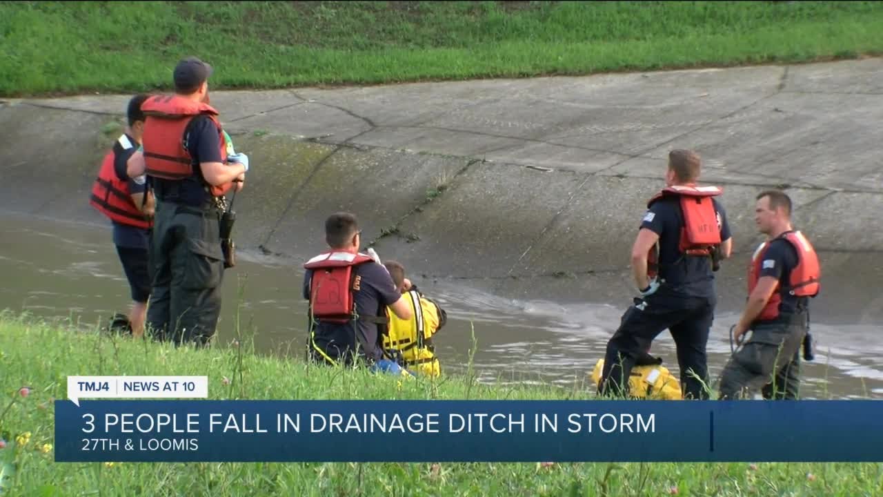 1 kid, 2 adults missing after falling in drainage ditch in storm - YouTube