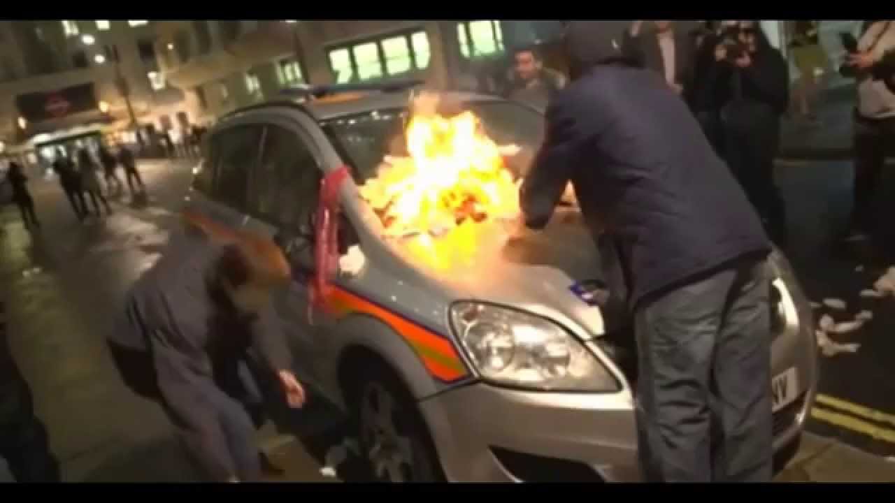 Million Mask March Protesters Set Police Car On Fire In London - YouTube