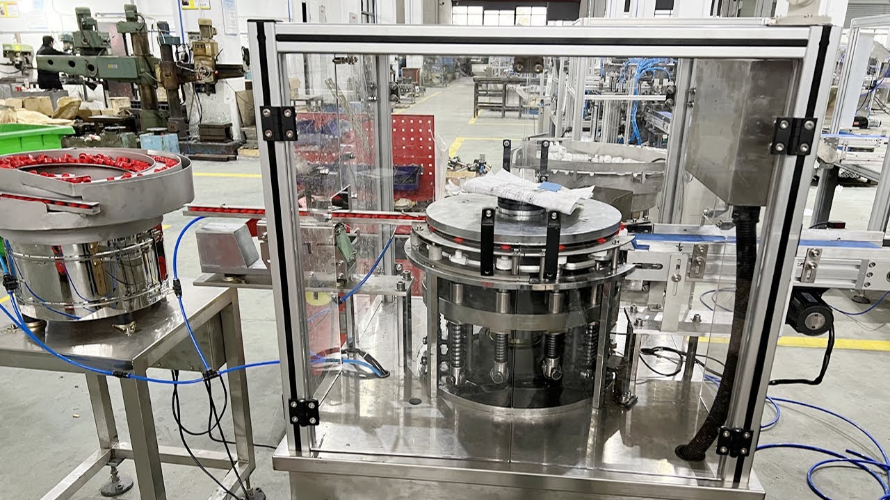 Automatic caps assembly machine (Both vibrating bowls are 600mm in ...