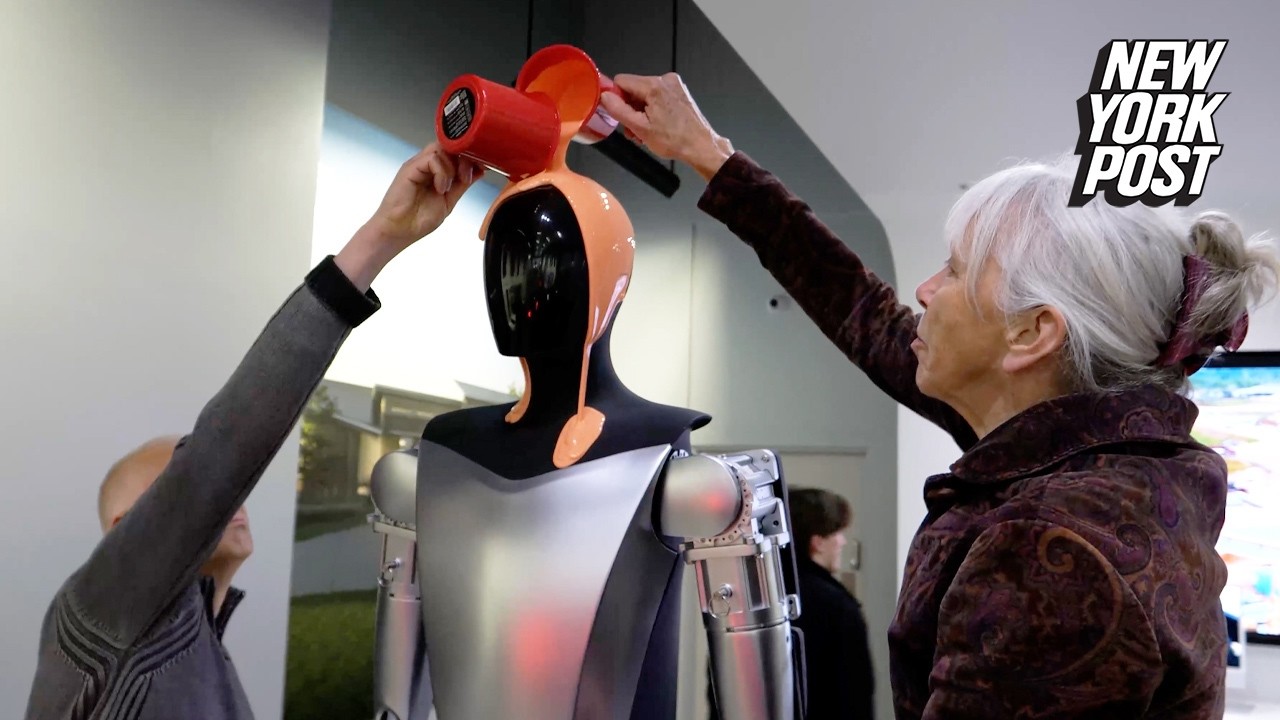 Tesla robot vandalized with liquid latex in London protest - YouTube