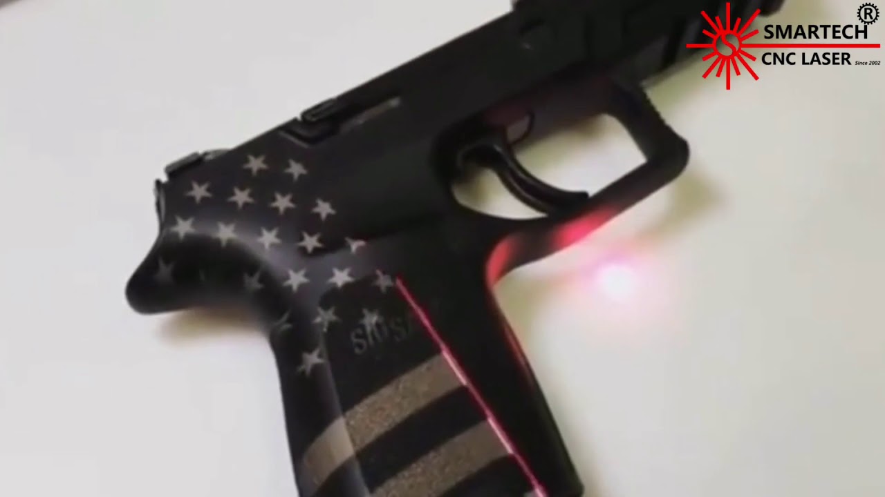 Laser marking on guns - YouTube