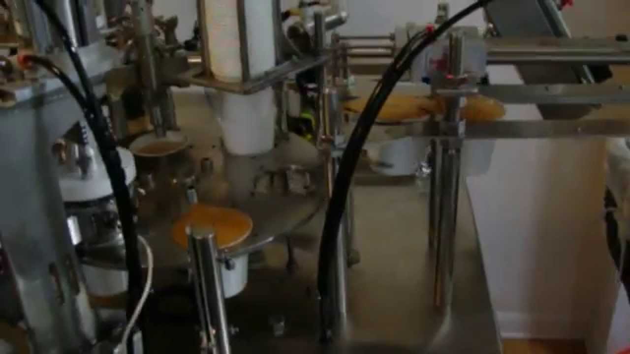 Fully Automatic Rotary Cup Filling and Sealing Machine - YouTube