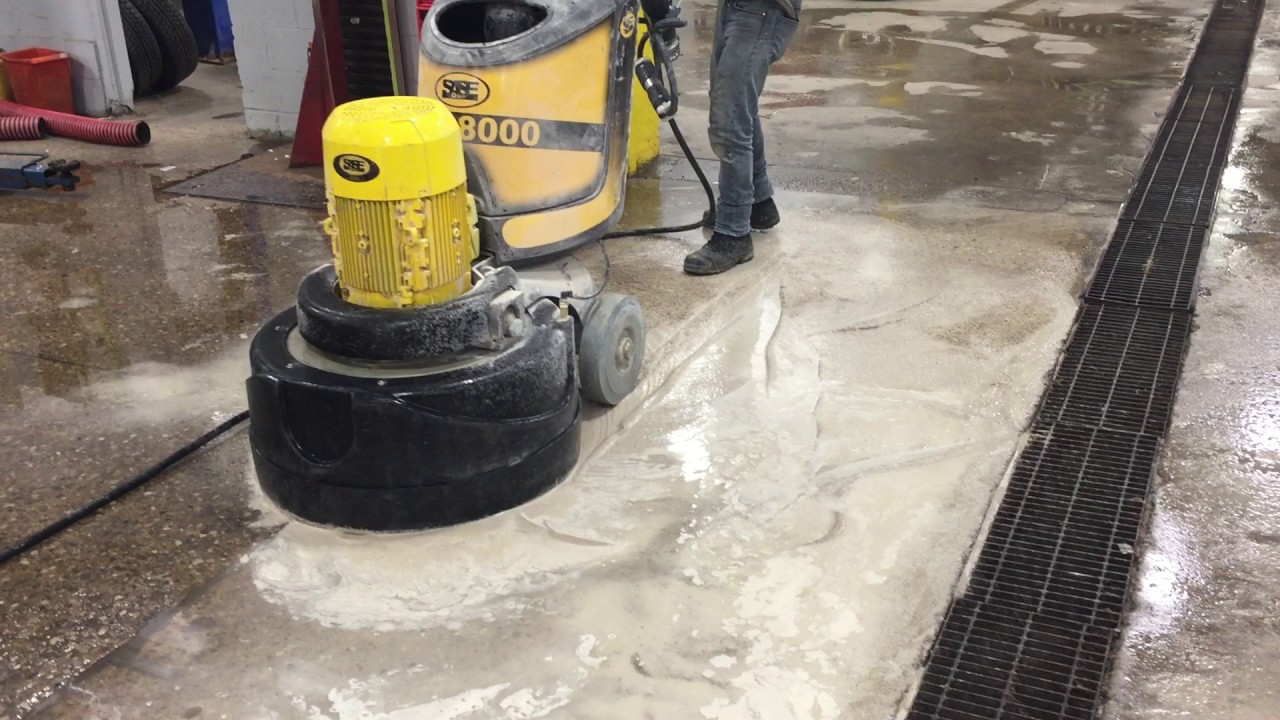 Concrete Grinding to make water flow to trench drain 1 - YouTube