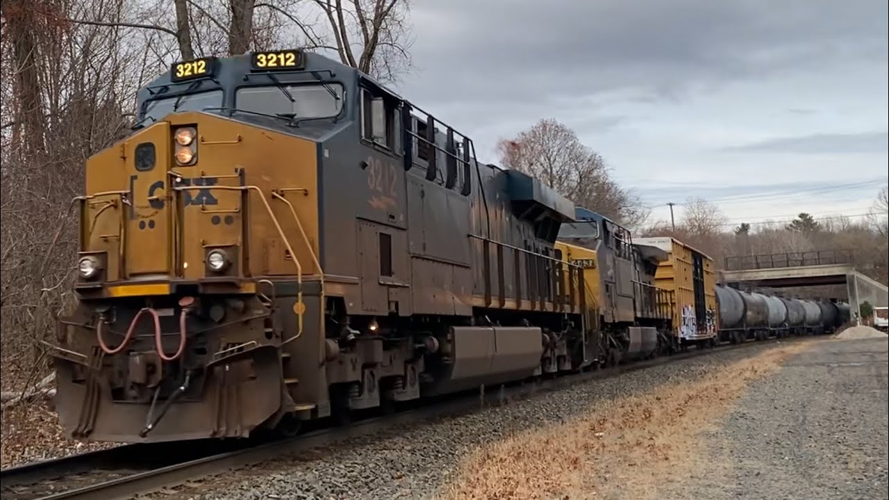 CSX B760 passes CP57 with locomotives 3212 and 443 and an unusual boxcar as a buffer - YouTube