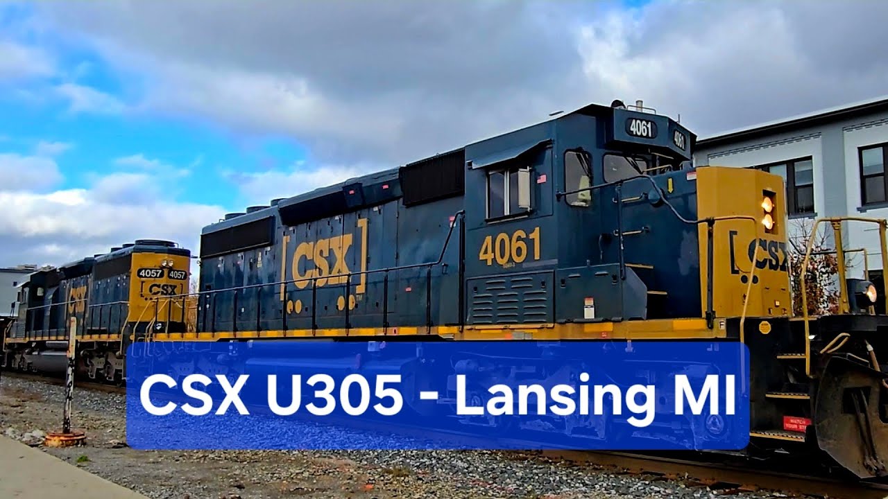 CSX Train U-305 heading through Lansing, MI with a load for Great Lakes Central! SD-40-3 duo ...