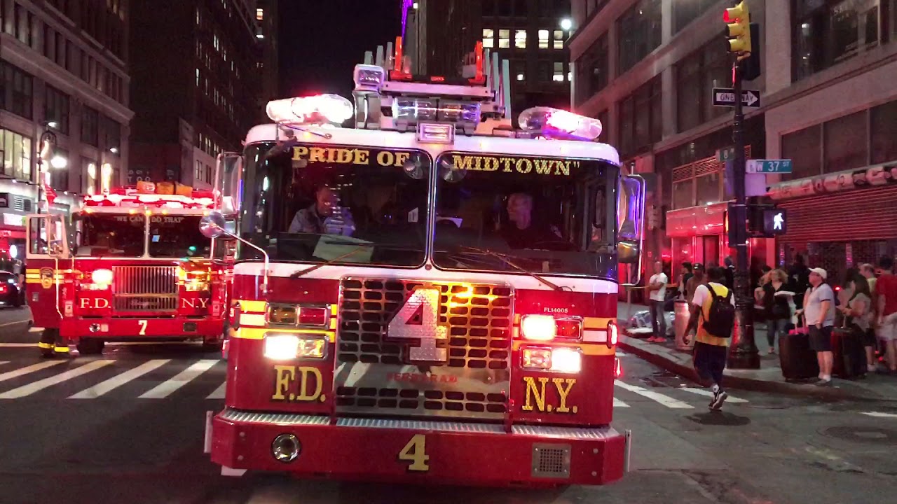 FDNY LADDER 4 TAKING UP FROM A 10-76 HIGH RISE COMMERCIAL FIRE ON 8TH ...