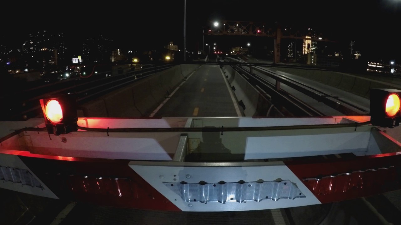 NYC Pulaski Bridge goes up at night to let a boat pass on Newtown Creek ...