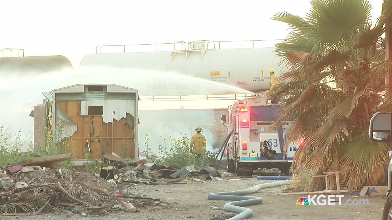 Firefighters control fire burning near tracks near Golden State Avenue ...