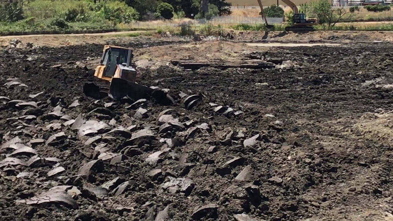 Wind-rowing the pond bottom in pond A-2 to dry the soil - YouTube