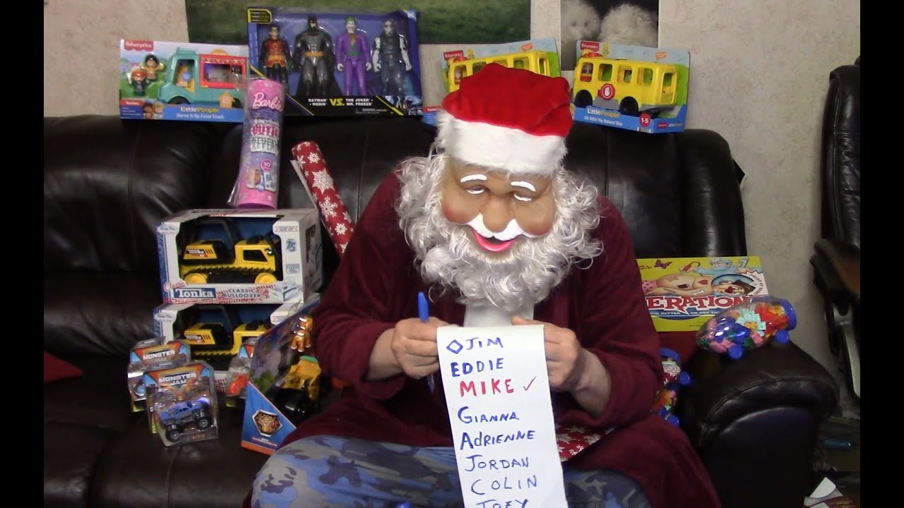 Santa Claus checks his list while wrapping Presents! - YouTube