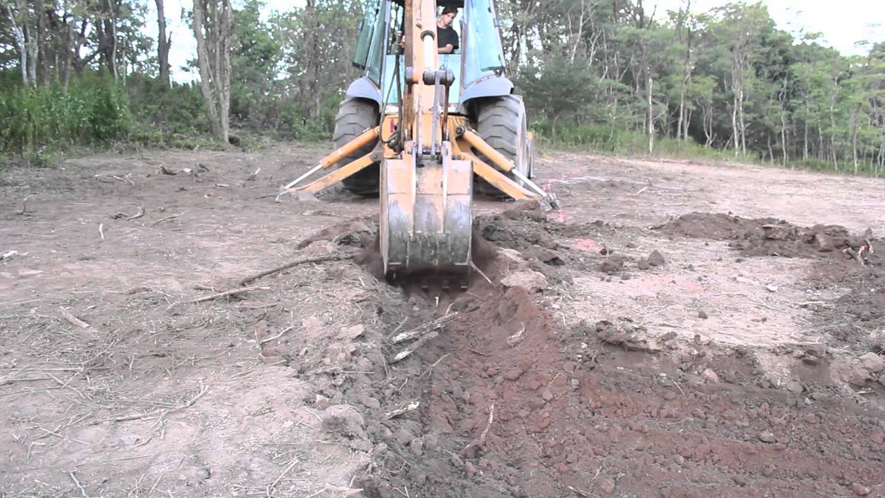Stripping Topsoil with the Backhoe - YouTube